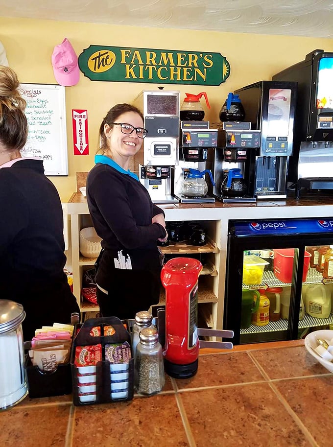 The smile says it all: genuine New Hampshire hospitality isn't manufactured in a corporate handbook—it's served fresh daily alongside the pancakes.