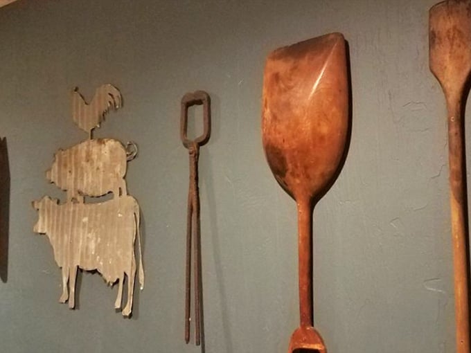 The wall decor tells stories of farm-to-table traditions—wooden implements that worked the land now celebrate the harvest.