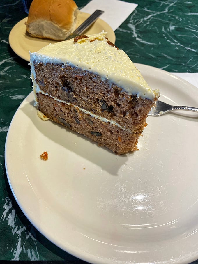 Carrot cake that doesn't pretend to be health food, with cream cheese frosting thick enough to leave evidence on your nose.