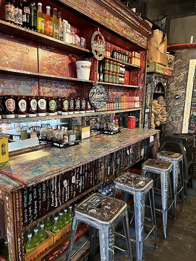 The counter where magic happens—bottles of hot sauce stand at attention like soldiers guarding the secret to perfect breakfast flavors.
