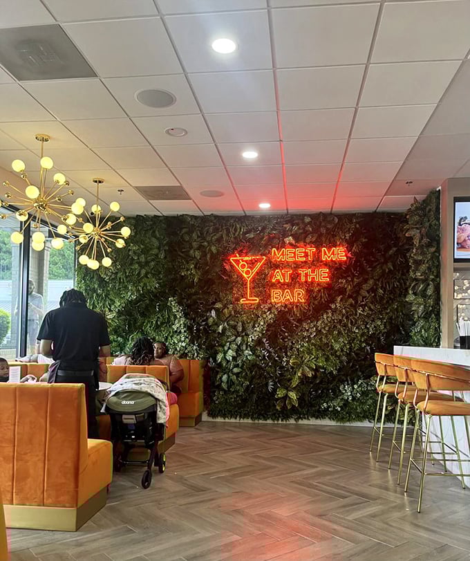 "Meet Me At The Bar" isn't just neon signage—it's life advice glowing against a living wall of greenery.