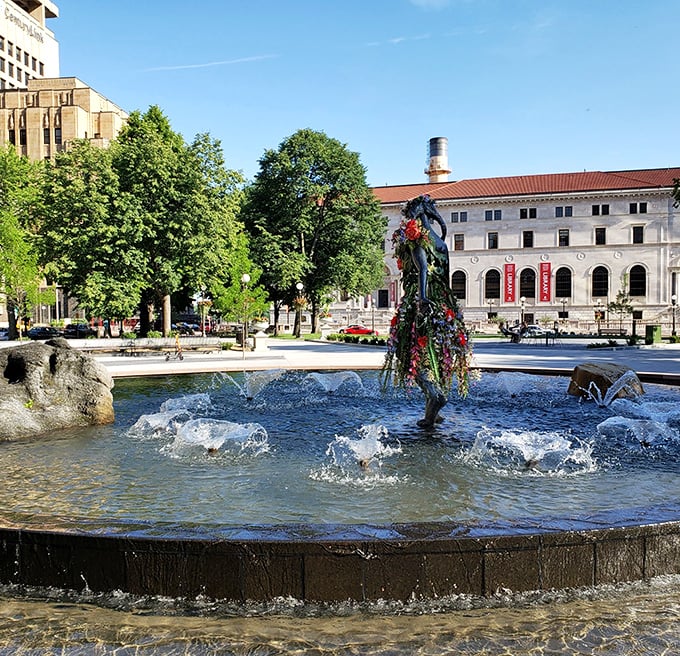 Outside in Rice Park, the fountain creates a peaceful counterpoint to the Landmark's imposing architecture—urban serenity at its finest.