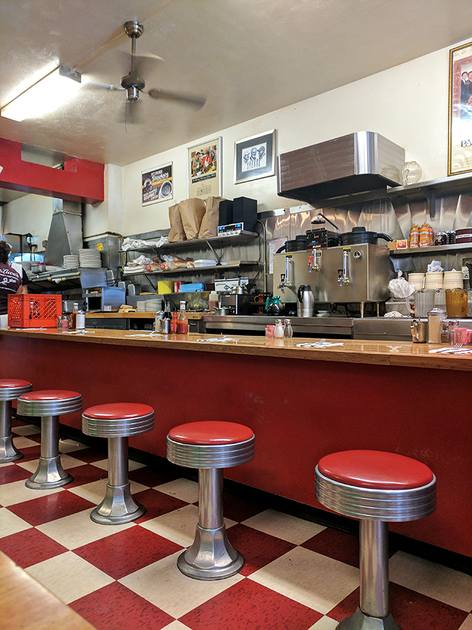 Red stools and counter service – where regulars have worn grooves in their favorite spots and servers know your order before you sit down.