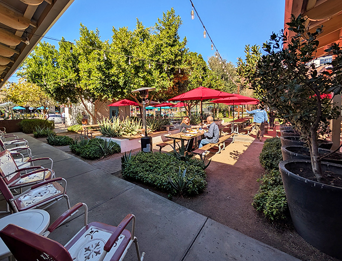 Al fresco dining under Arizona's endless blue sky. Those red umbrellas aren't just for shade – they're warning signals for "serious eating ahead."