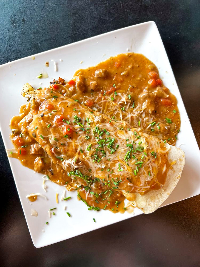 A smothered breakfast burrito that doesn't just say good morning—it sings it with a full mariachi band of flavors.