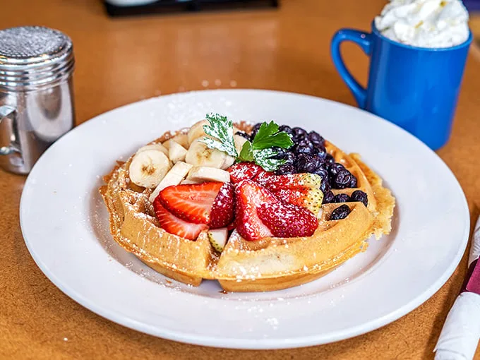 This waffle doesn't just have toppings—it has a fruit festival. Fresh berries and bananas transform breakfast into an occasion worth celebrating.