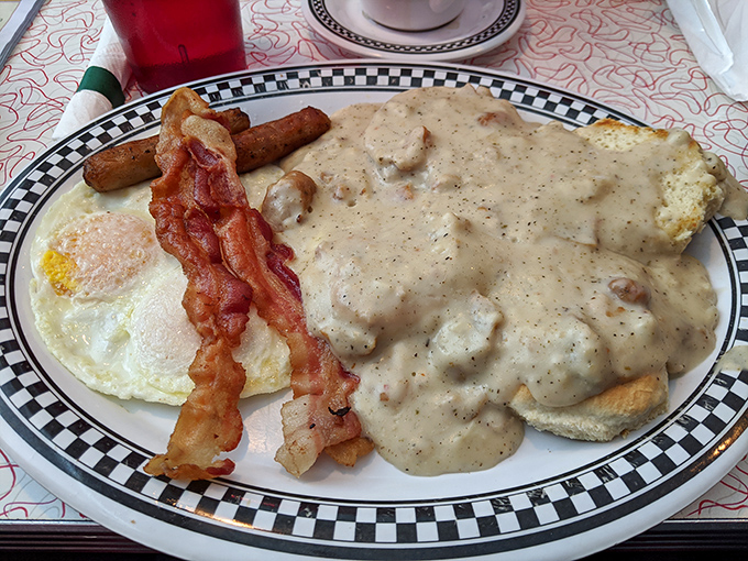Biscuits and gravy with a side of everything good in this world—eggs, bacon, and sausage links forming a breakfast alliance that's impossible to resist.