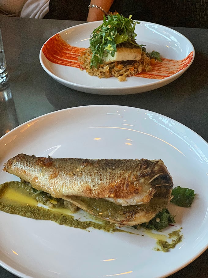 This branzino isn't just a fish—it's a Mediterranean vacation on a plate. The skin is crisped to perfection, like it spent the afternoon sunbathing.