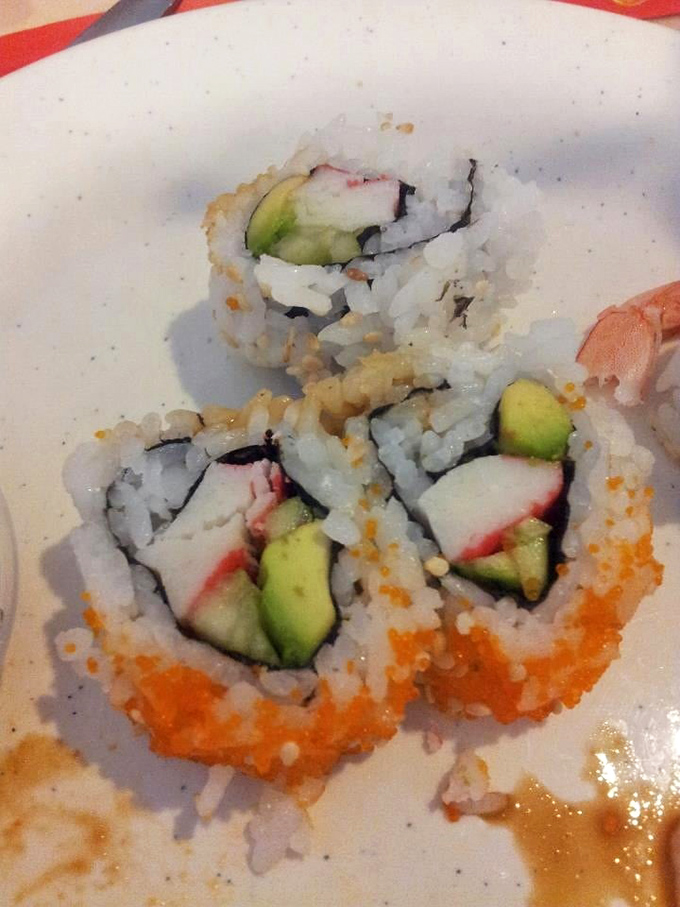 California rolls with their vibrant orange roe garnish—sushi's gateway drug that's converted more Americans to raw fish than any other culinary ambassador. 