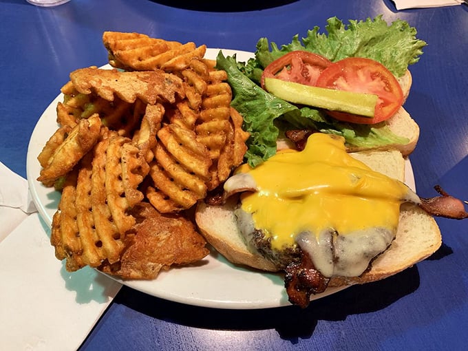 A burger that understands the importance of proper cheese-to-meat ratio. Those waffle fries are the supporting actors who steal the scene.