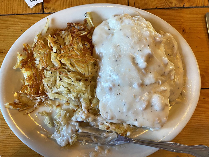 When gravy covers half your plate, you know you're in for a good day. This country benedict doesn't just break your diet—it demolishes it with joy.