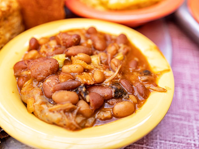These aren't your sad, straight-from-the-can baked beans—they're a savory stew where beans mingle with smoky meat bits like they're at the world's tastiest pool party.