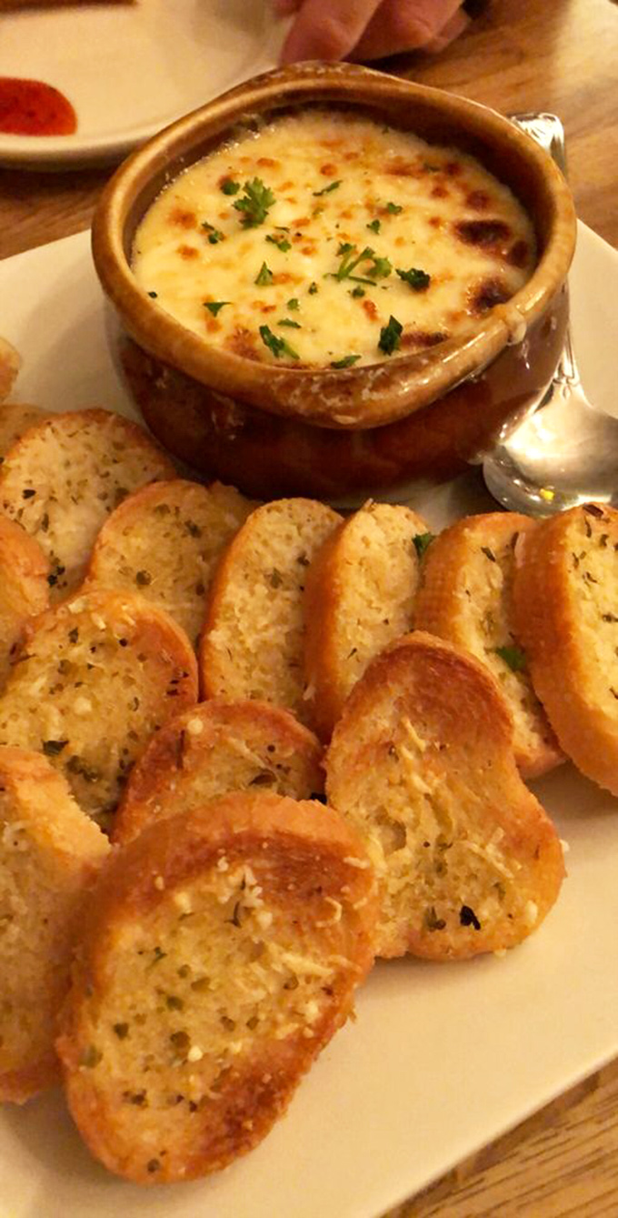 This crab dip isn't just appetizing—it's hypnotizing. Those golden-brown crostini are just vehicles for delivering maximum seafood satisfaction.