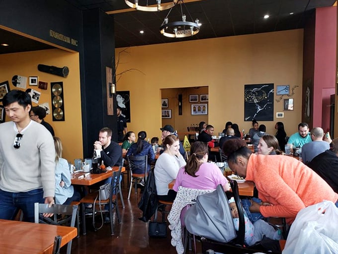 A packed house of diners unified in the sacred pursuit of comfort food excellence, creating a symphony of satisfied mmms and ahhs.