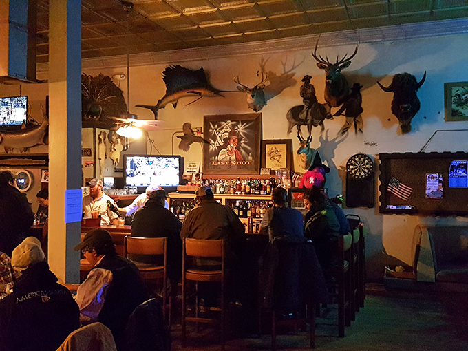 The bar at Big Ed's—where hunting trophies watch over patrons who debate football, cattle prices, and whether to order dessert after all that meat.