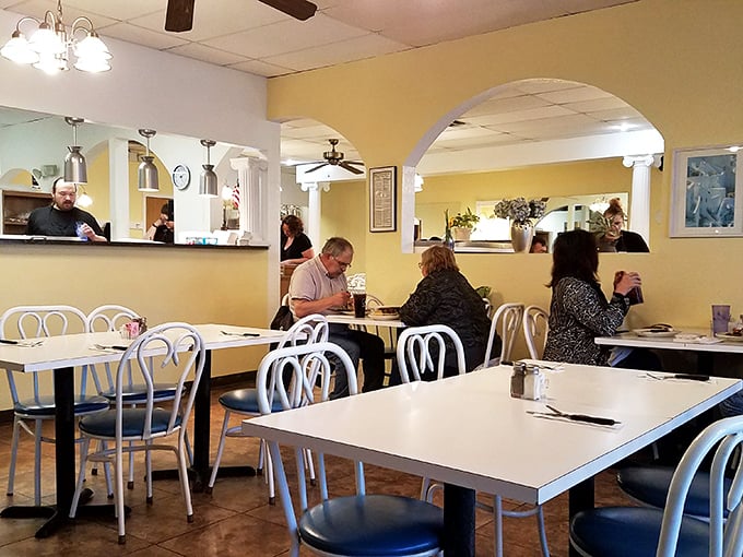 A dining room where conversations flow as easily as the ouzo. Notice how nobody's on their phone? That's the power of really good food.