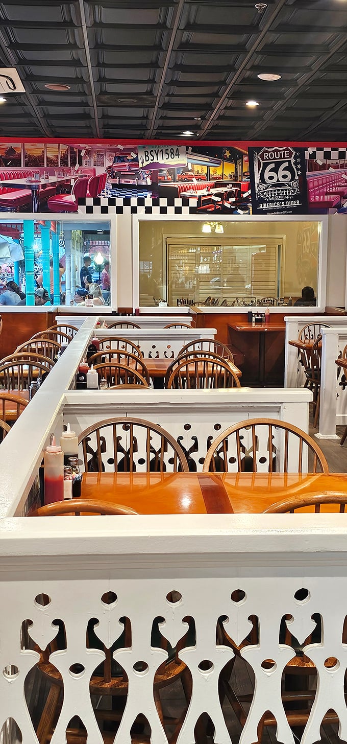Red booths, checkered patterns, and a mural that stretches across the wall—this isn't just dining, it's dinner and a show.