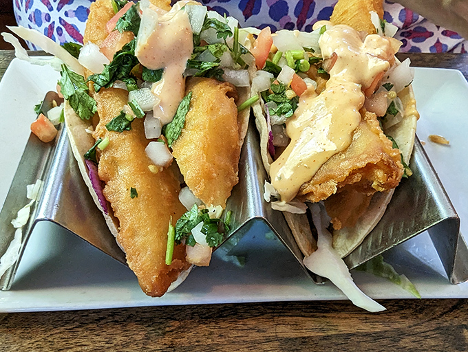 Fish tacos that balance crunch, cream, and garden-fresh toppings—architecture you can eat and art you can taste.