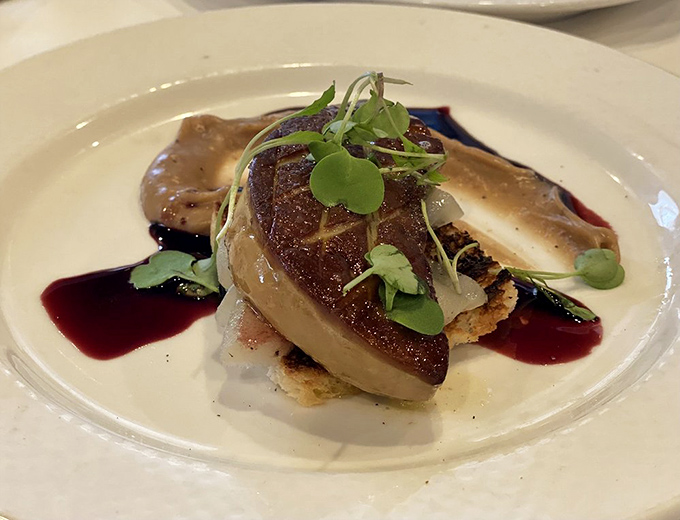 This perfectly seared foie gras isn't just food—it's edible poetry, plated with artistic precision and a sauce that deserves its own sonnet.