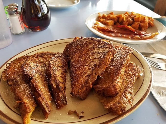 French toast that's had a proper education – crispy edges, custardy centers, and enough cinnamon to make your morning memorable.