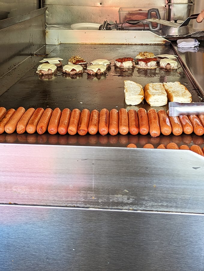 The flat-top grill—where burger patties and hot dogs go to fulfill their delicious destiny. This is the altar where fast food becomes transcendent.