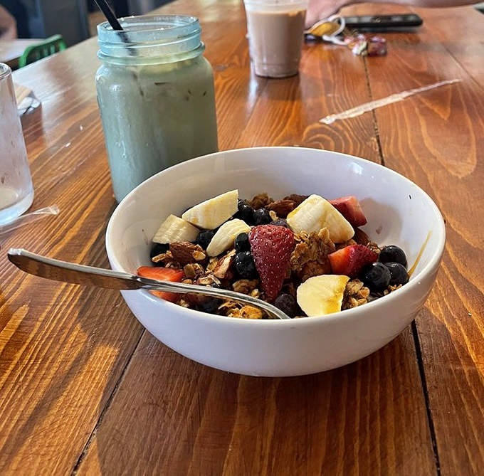 House-made granola with fresh fruit—breakfast's answer to jewelry. Each spoonful is like a little collection of edible gems.