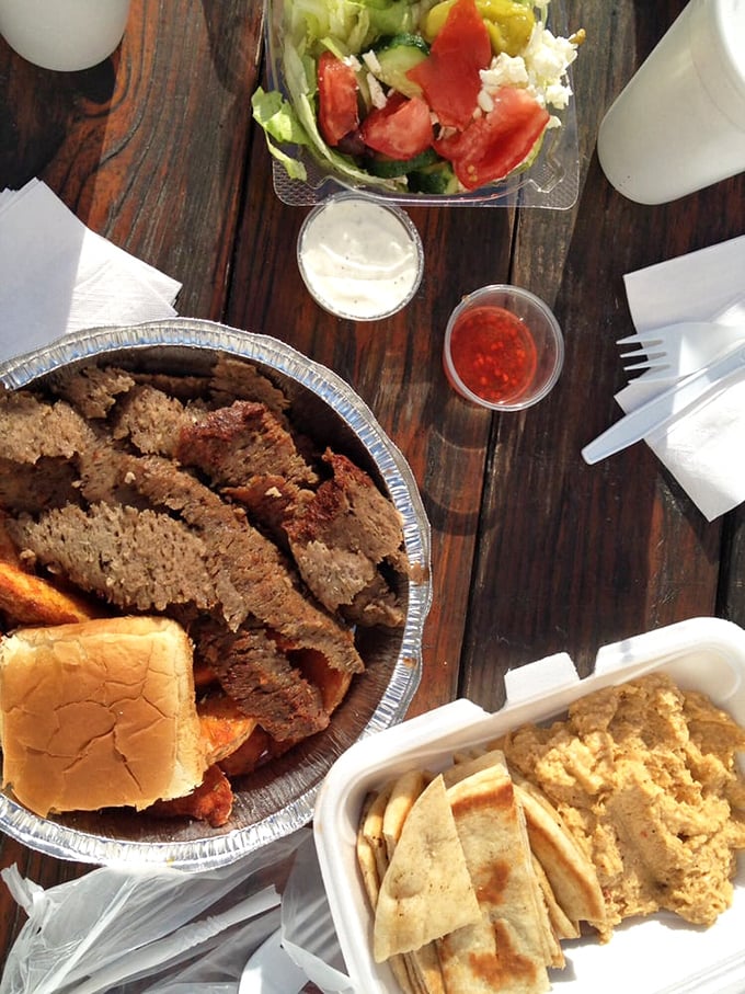 This spread isn't just a meal—it's a Mediterranean festival on wood. The hummus isn't a side dish; it's the creamy ambassador of chickpea diplomacy.
