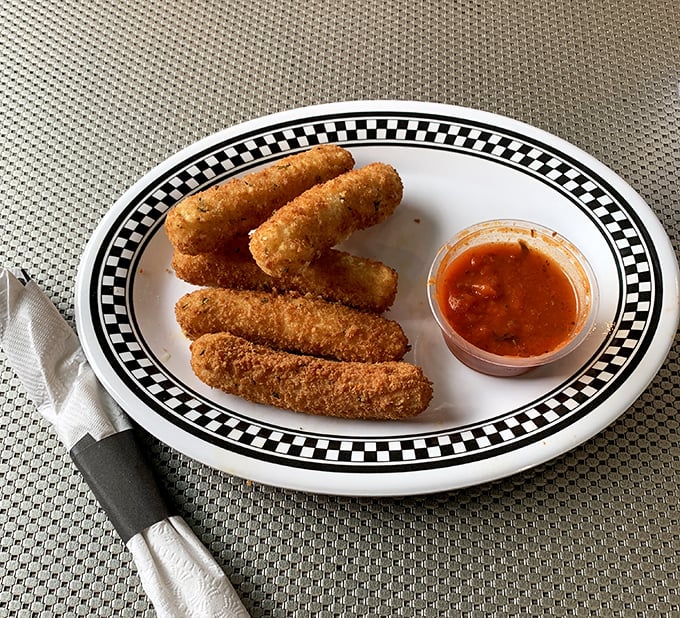 Golden-brown outside, molten perfection inside. These mozzarella sticks don't just stretch—they perform a full gymnastics routine.