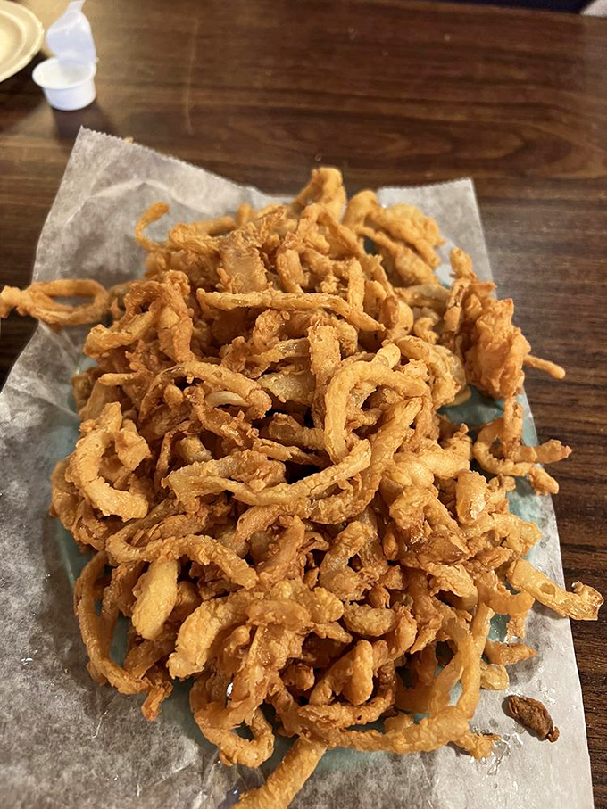 These aren't just onion rings; they're crispy golden halos celebrating America's commitment to deep-fried excellence.
