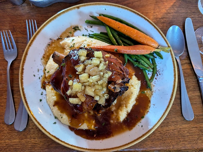 This isn't just pot roast—it's a time-traveling flavor bomb served atop creamy mashed potatoes with vegetables that actually had a life before the plate.