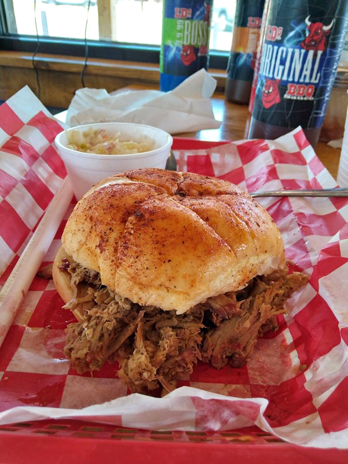 The pulled pork sandwich – architectural marvel of meat and bun. Requires both hands, several napkins, and zero shame.