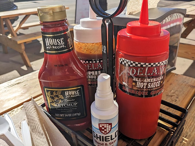 The sauce caddy—barbecue's version of a jewelry box, holding liquid treasures ranging from mild to "now you're having an adventure."
