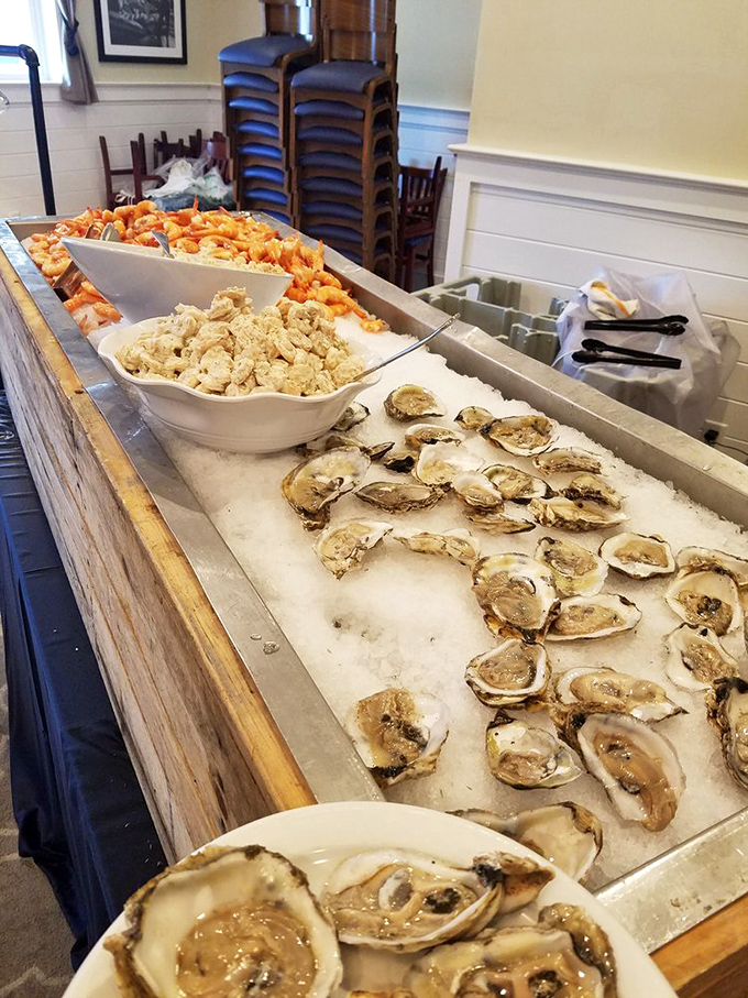 The raw bar display – where sea treasures rest on ice before their grand finale. Oysters waiting patiently for their lemon squeeze.
