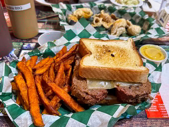 This sandwich isn't just lunch—it's architecture. Sweet potato fries on the side are the supporting cast to this smoky star.