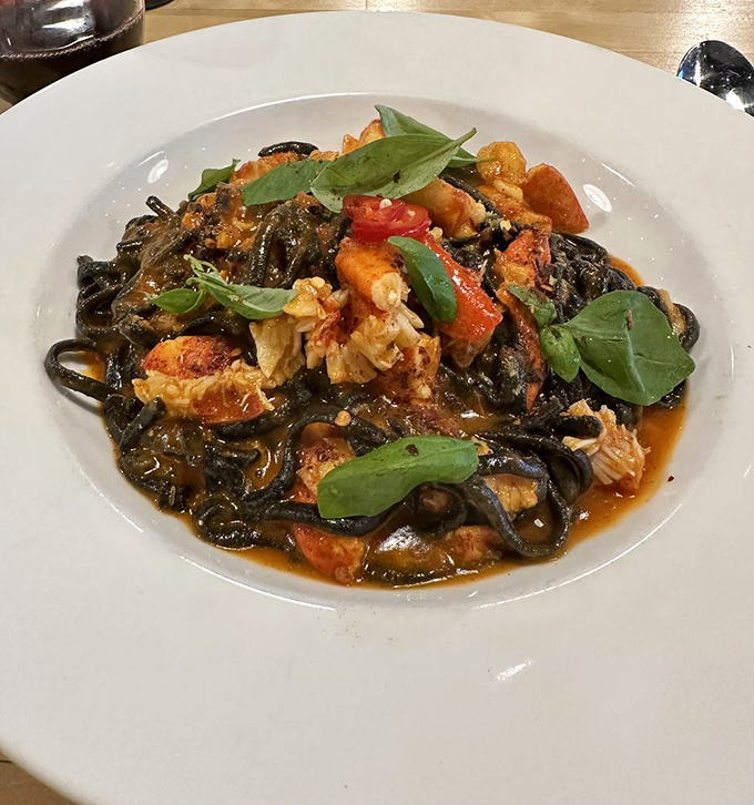 Squid ink pasta with lobster—where the ocean meets Italy in a dramatic, delicious collision that belongs on the cover of Food & Wine.