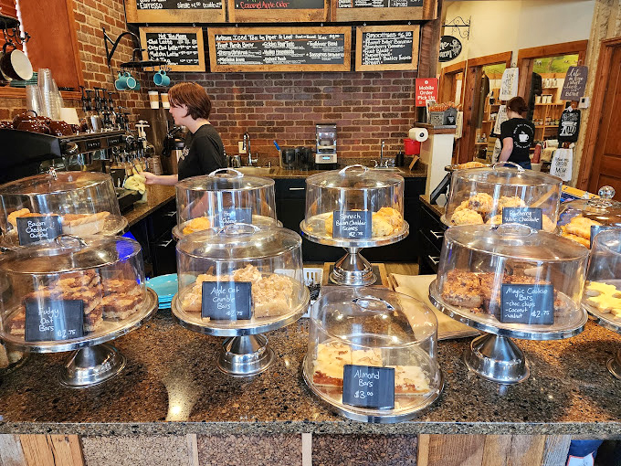 Behind every great coffee is a team of passionate professionals. The pastry display cases standing at attention like delicious soldiers ready for deployment.