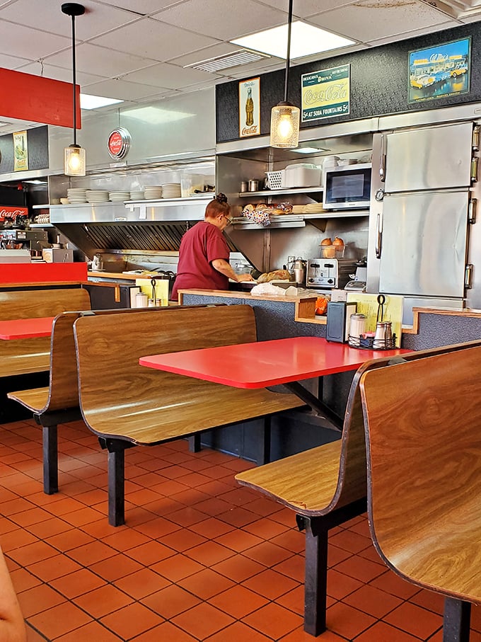 The coffee-pouring ritual – a sacred diner tradition performed by staff who know your cup needs refilling before you do.