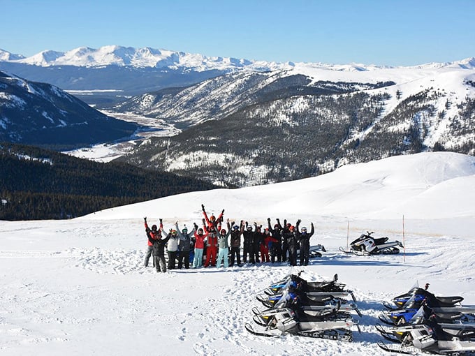 When you're on top of the world, raising your arms in victory isn't showing off—it's the only appropriate response to Colorado's winter majesty.