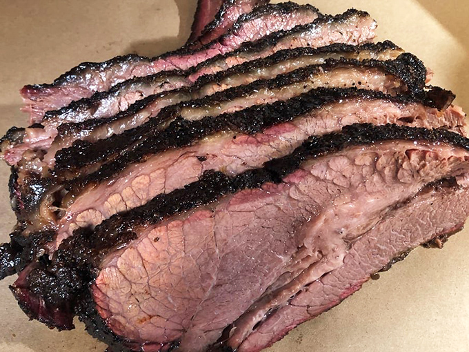 The open kitchen isn't just for show—it's theater where smoke and fire transform ordinary cuts into extraordinary experiences right before your eyes.
