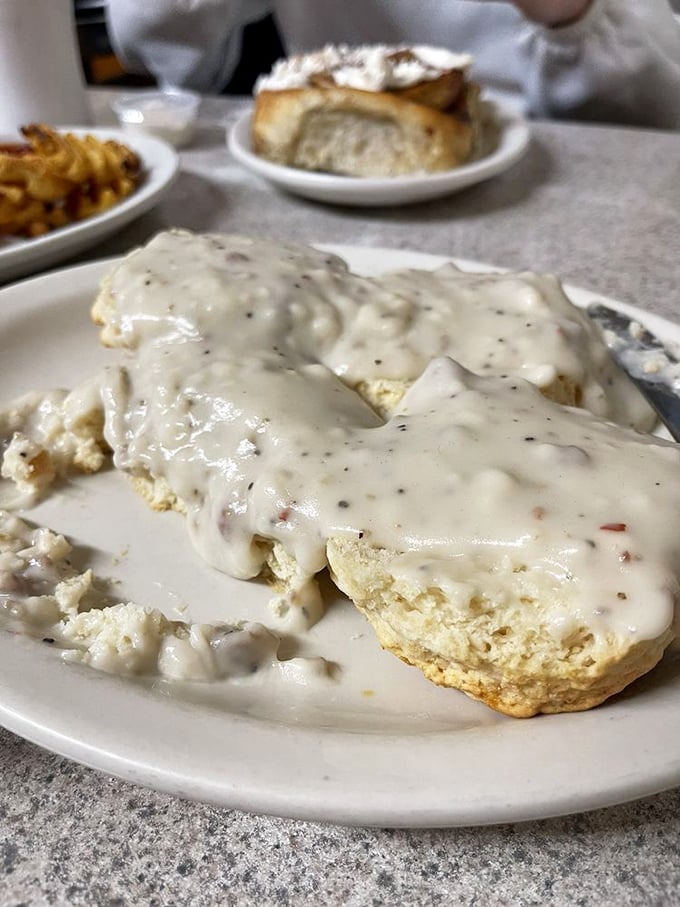 Biscuits and gravy that don't mess around—this plate delivers the kind of comfort that usually requires a prescription or a therapist.