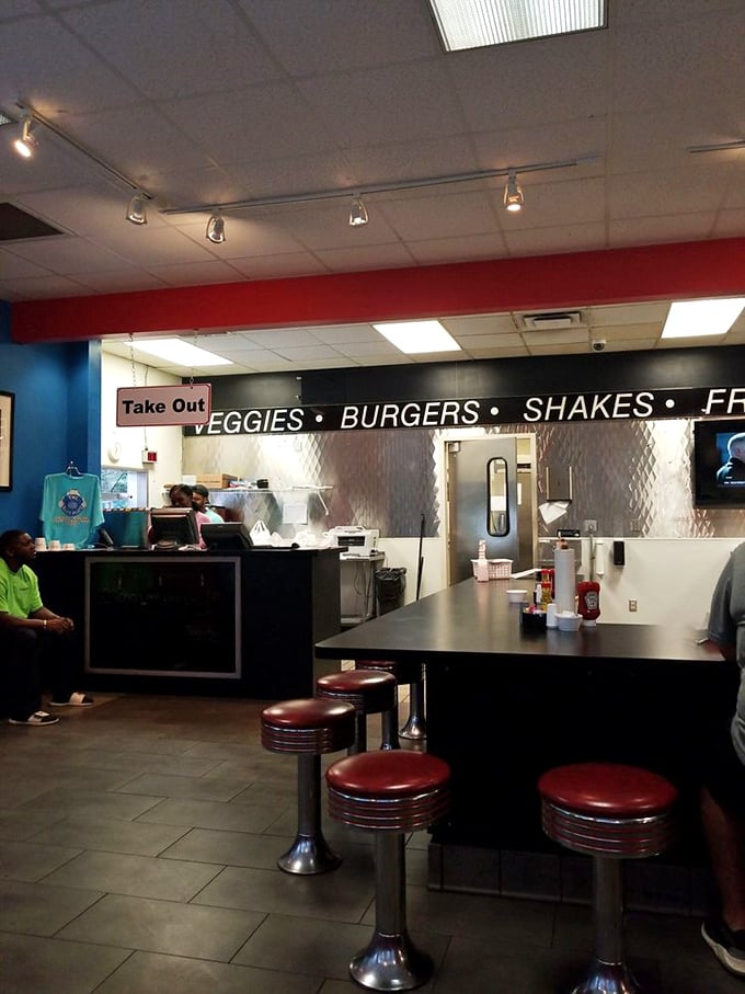Where the magic happens—glimpse the kitchen pass-through where Southern dreams come true on a plate. Those counter stools have witnessed many happy meals.