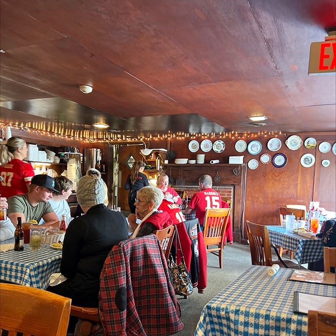 Locals gather at their tables like they're in their own dining rooms, a testament to decades of Kansas City chicken devotion.