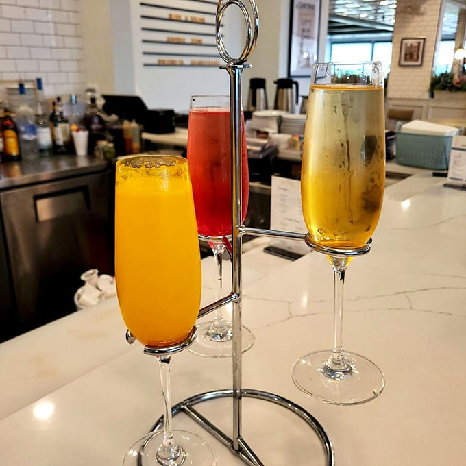 A mimosa flight that proves breakfast cocktails deserve the same attention as the food – sunshine in glassware ready to brighten your morning.