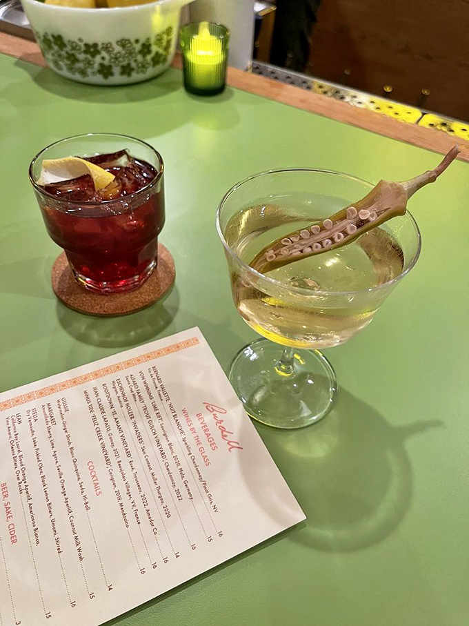 Cocktails that complement rather than compete with the food. That squid garnish isn't just for show—it's a conversation starter in a glass.