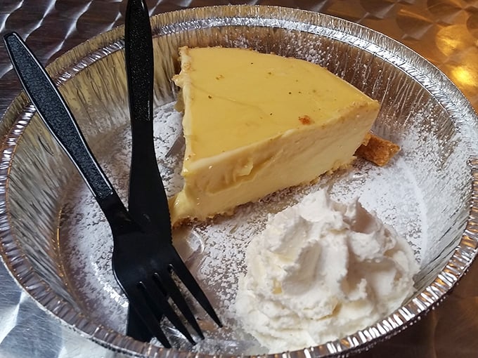 Key lime pie with a dollop of whipped cream. That perfect yellow hue isn't food coloring—it's the real deal, folks.