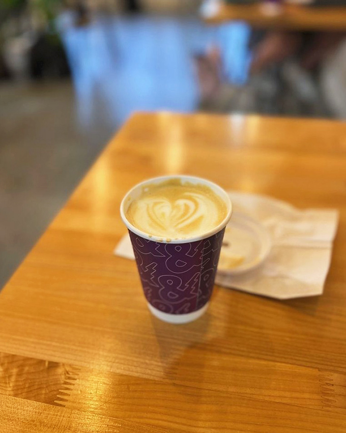 That heart-shaped latte art isn't just showing off—it's visual evidence of the care and craftsmanship that makes City & State's coffee worth crossing state lines for.