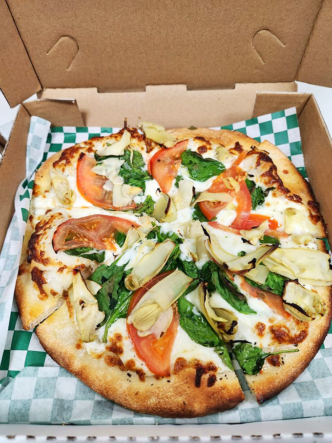 Fresh pizza that proves simplicity is sophistication—artichoke, tomato and spinach playing a perfect harmony without overshadowing each other.