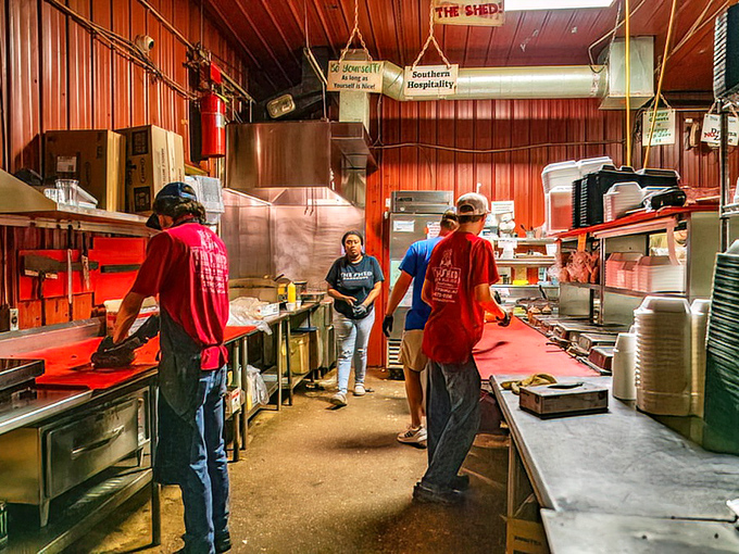 The kitchen crew – BBQ's unsung heroes working their smoky magic while the rest of us just show up and take all the delicious credit.