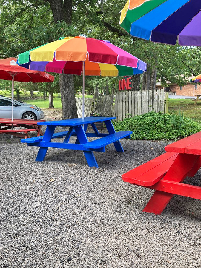Rainbow umbrellas and picnic tables create the perfect summer dining spot where memories are made between bites of burgers and sips of shakes.