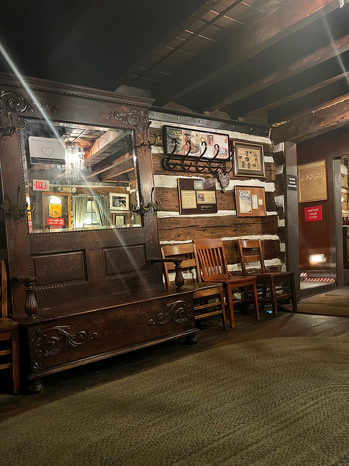 The waiting area's vintage wooden bench and antique mirror aren't just decor—they're silent witnesses to decades of pre-dinner anticipation and post-meal satisfaction.